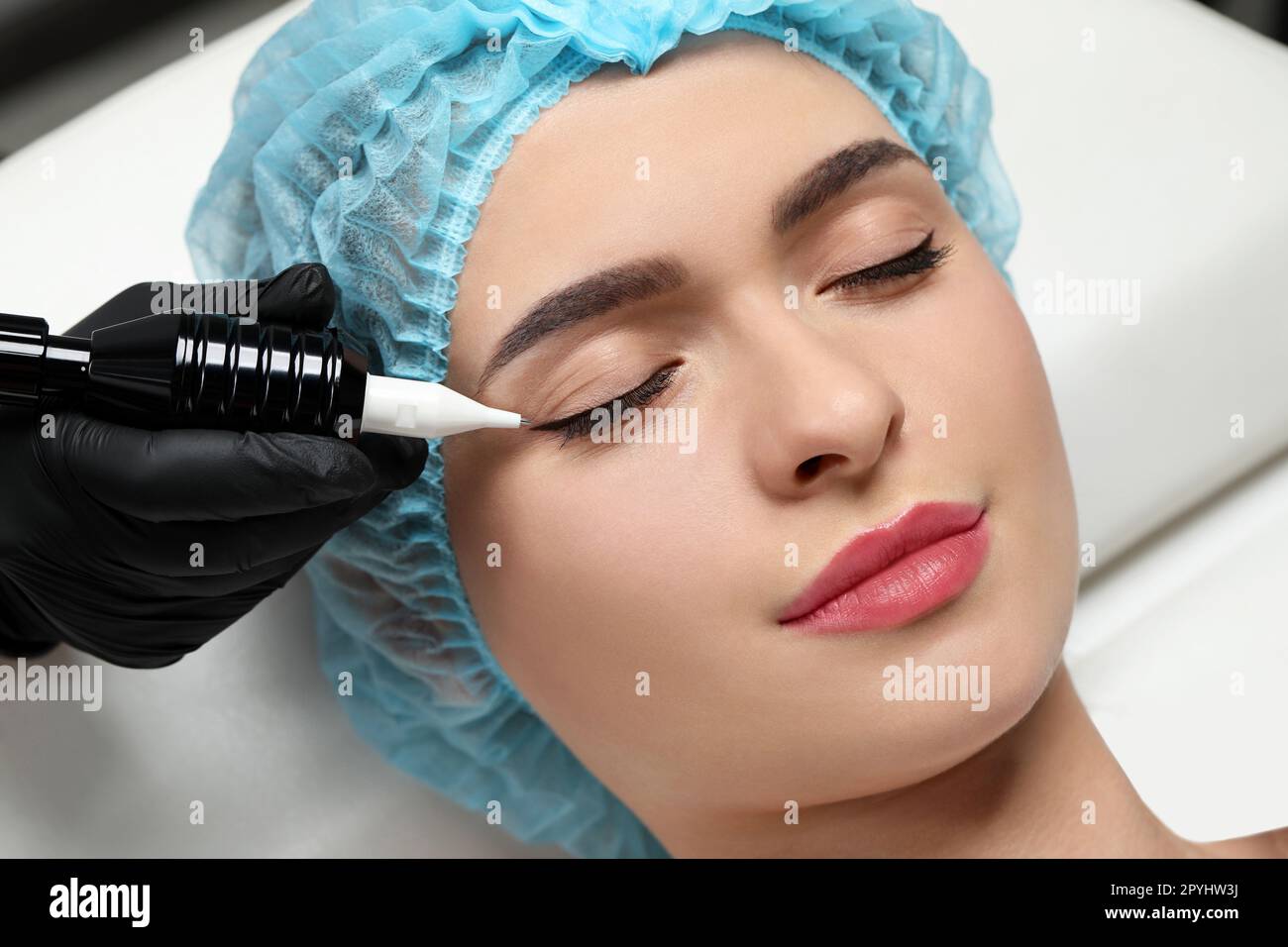 Young woman undergoing procedure of permanent eye makeup, closeup Stock Photo - Alamy