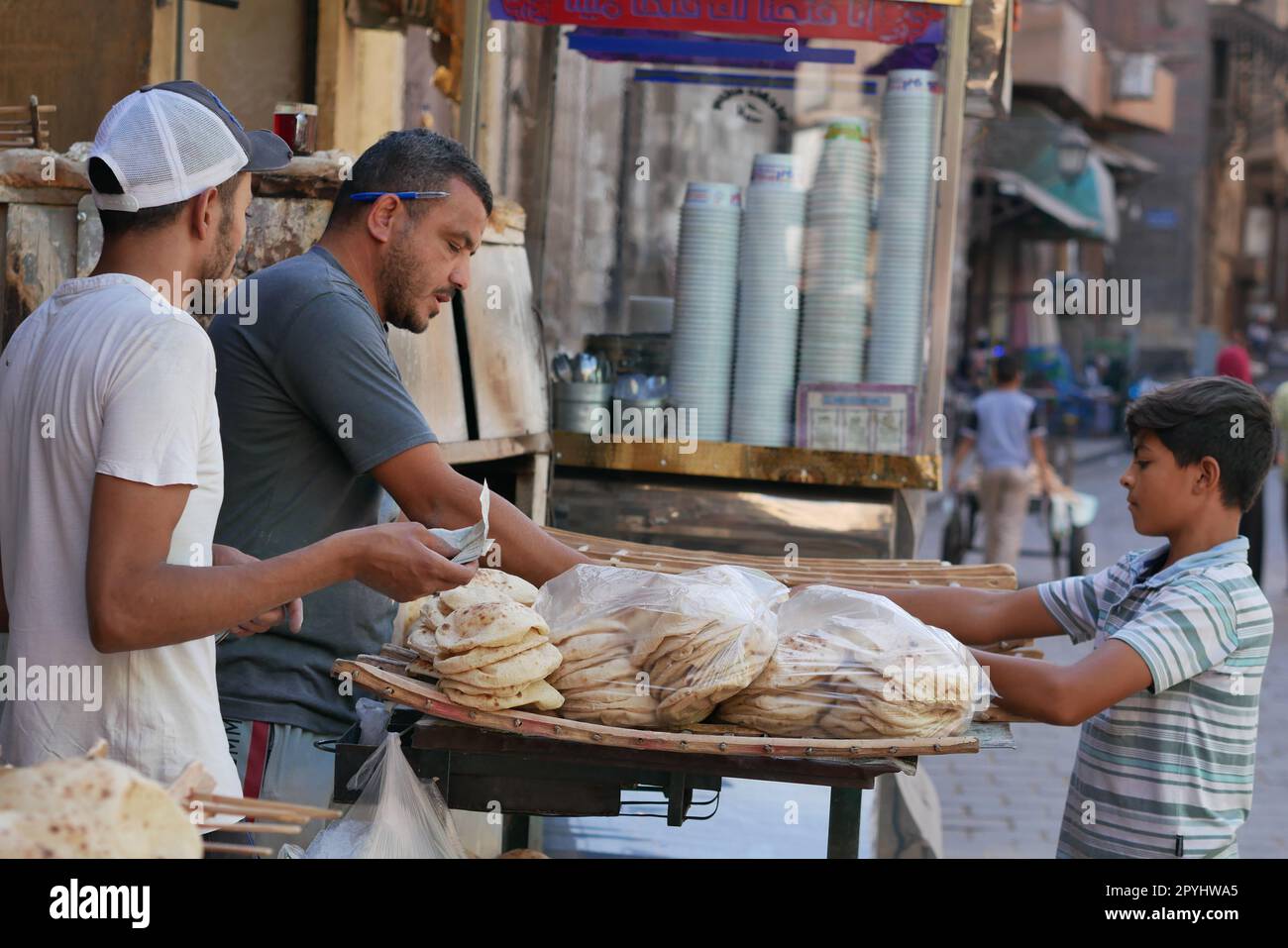Man selling bread on the streets of Islamic Cairo Stock Photo - Alamy