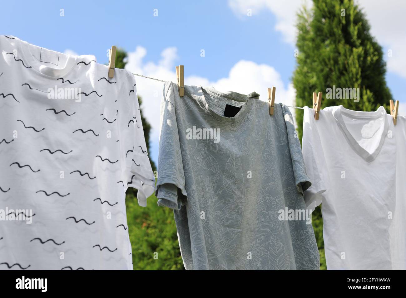 Washing line with clean clothes outdoors. Drying laundry outside Stock ...