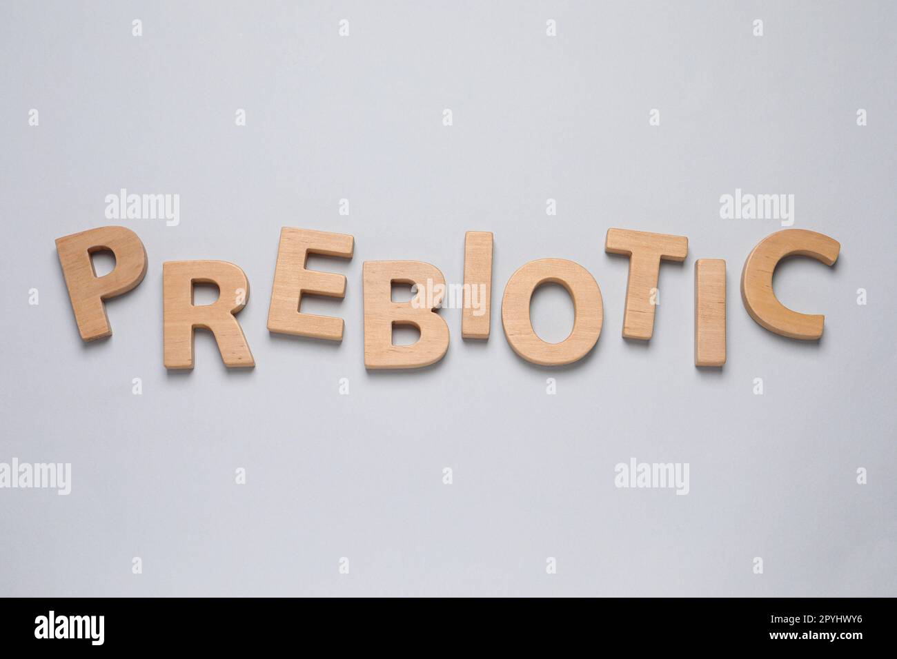 Word Prebiotic made of wooden letters on white background, top view ...