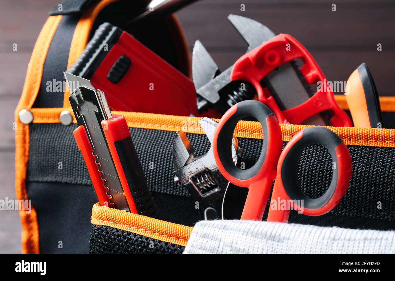 Bag with utility knife and different tools, closeup Stock Photo - Alamy