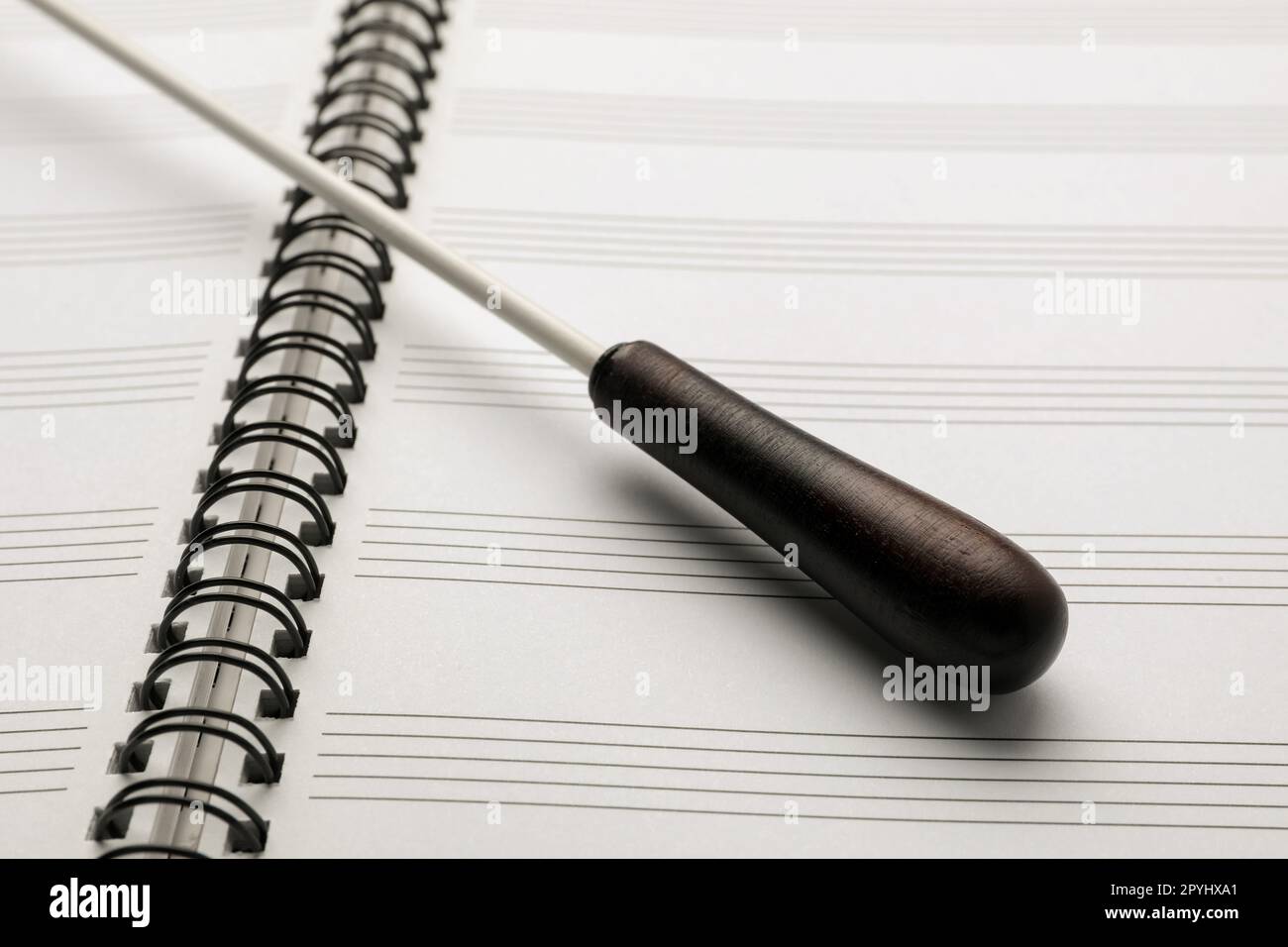 Conductor's baton on open lead sheet, closeup Stock Photo - Alamy