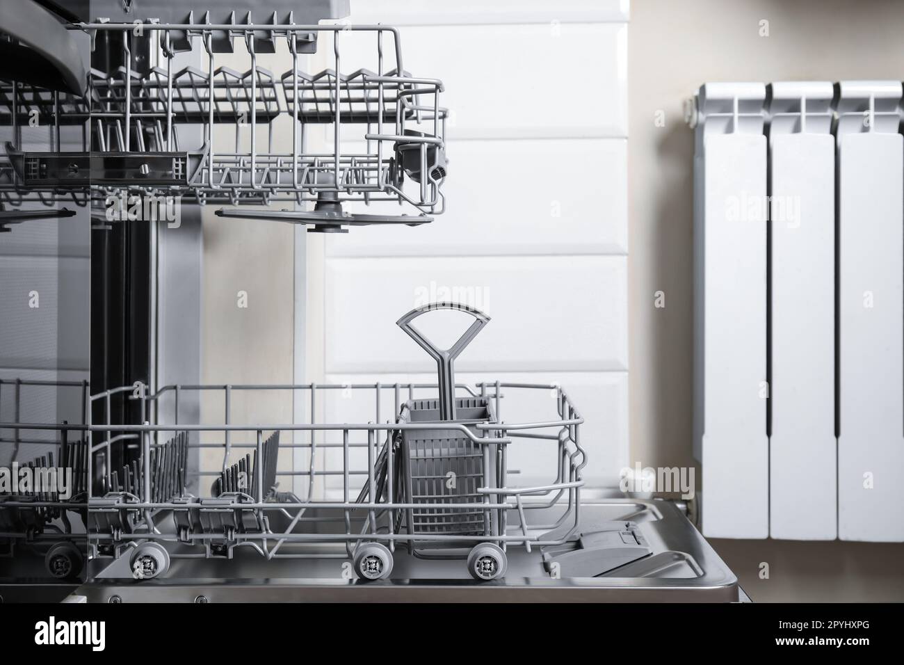 Open clean modern empty automatic dishwasher machine in kitchen Stock ...