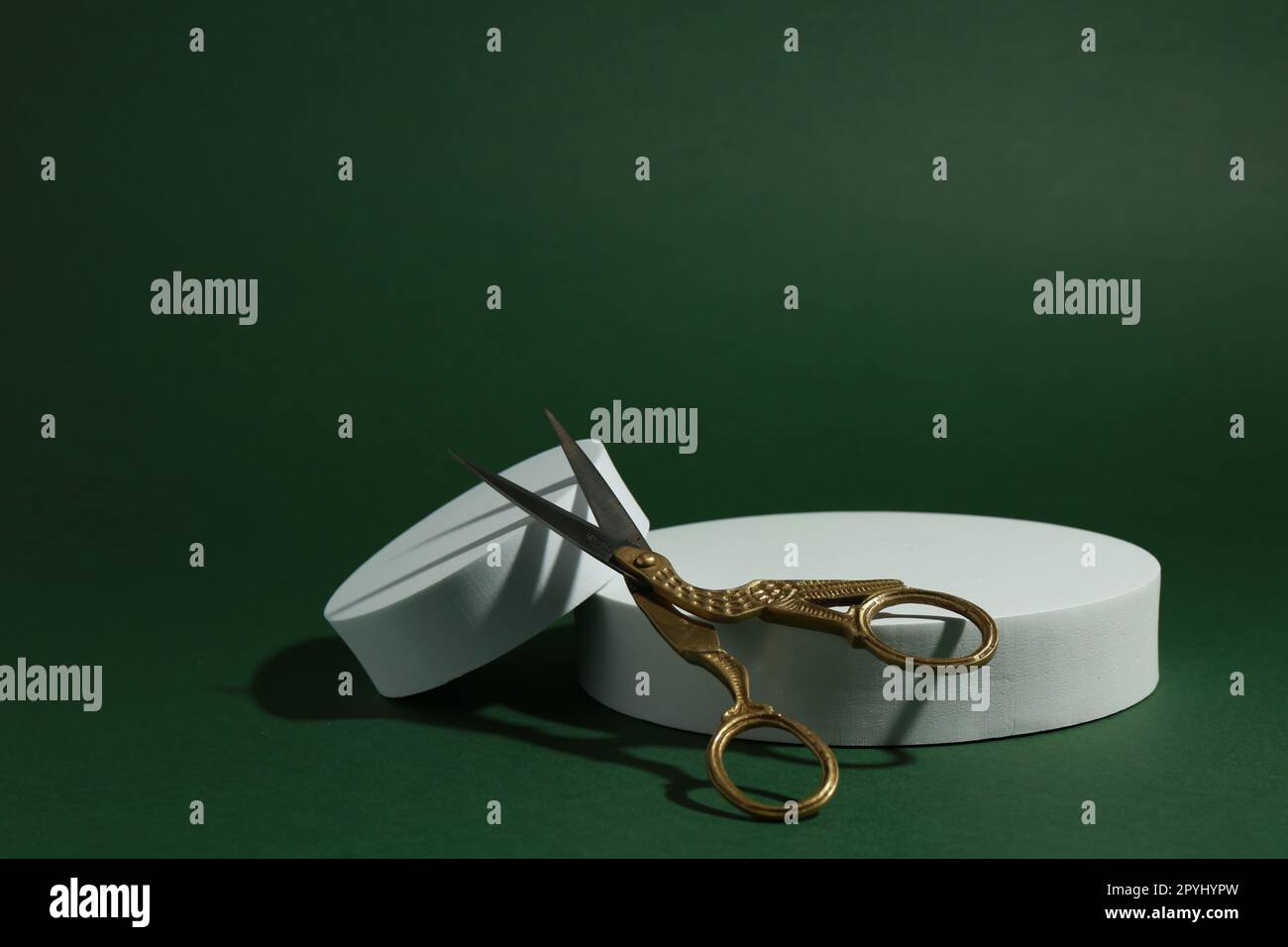 Product photography props. Round shaped podiums and vintage scissors on ...