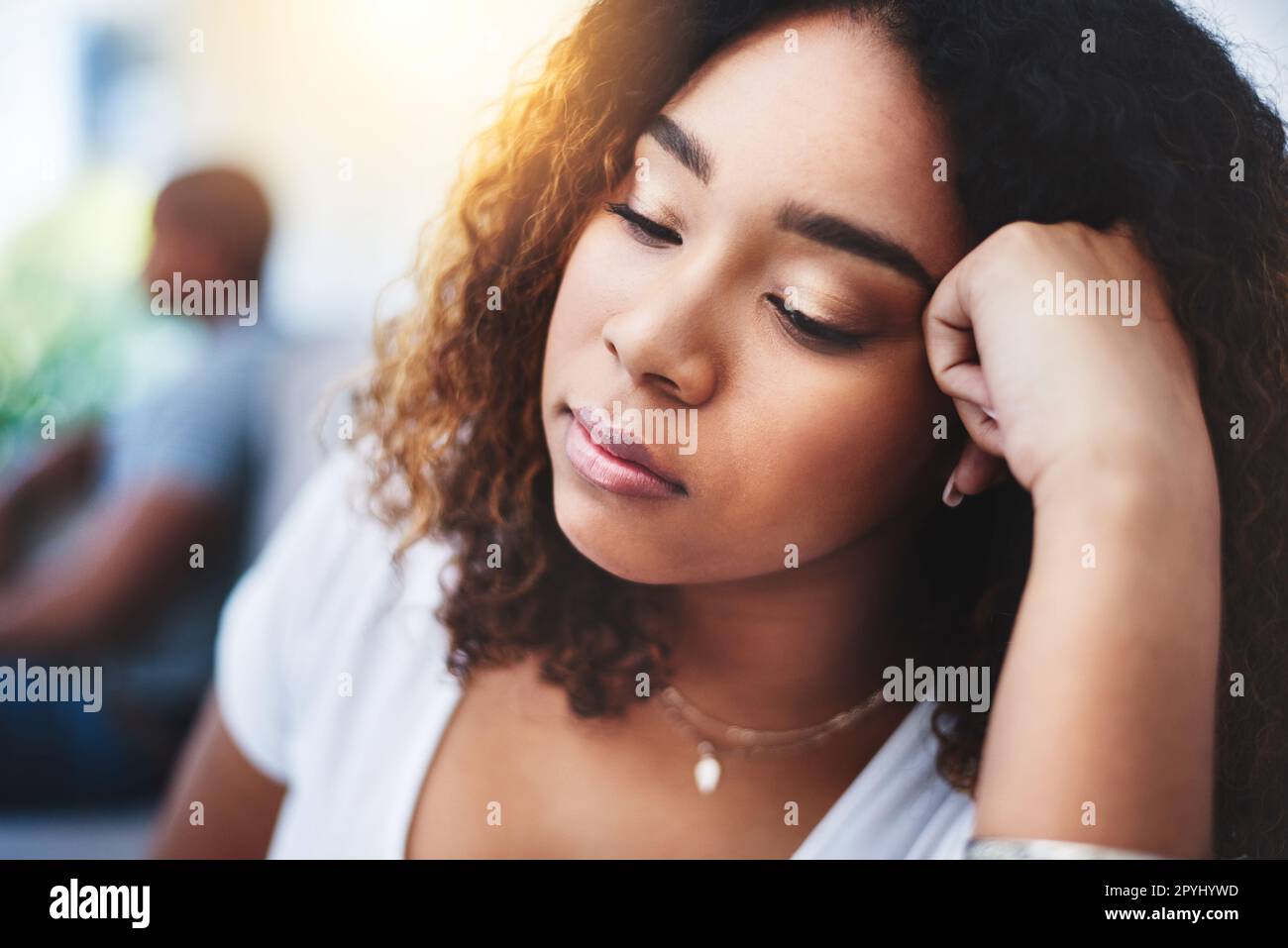 Its frustrating that we cant solve our problems. a young woman looking ...