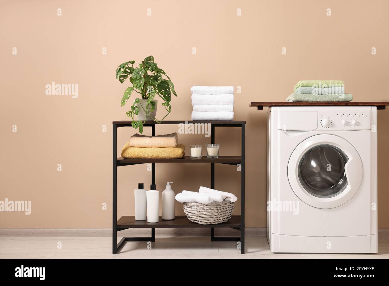 Stylish laundry room with modern washing machine. Interior design Stock ...