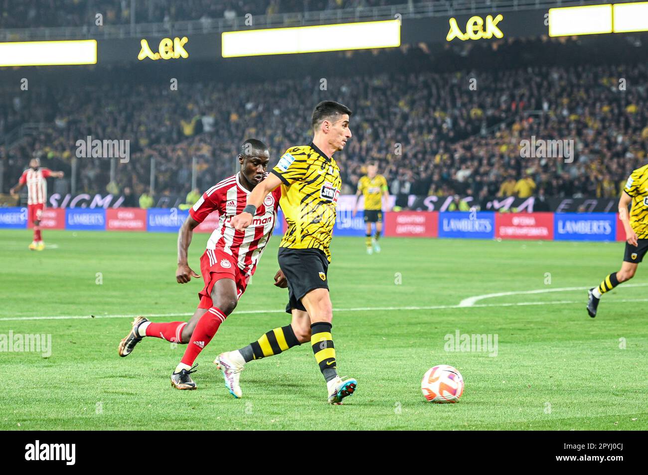 20 PETROS MANTALOS of AEK FC competing with 38 DIADIE SAMASSEKOU of ...