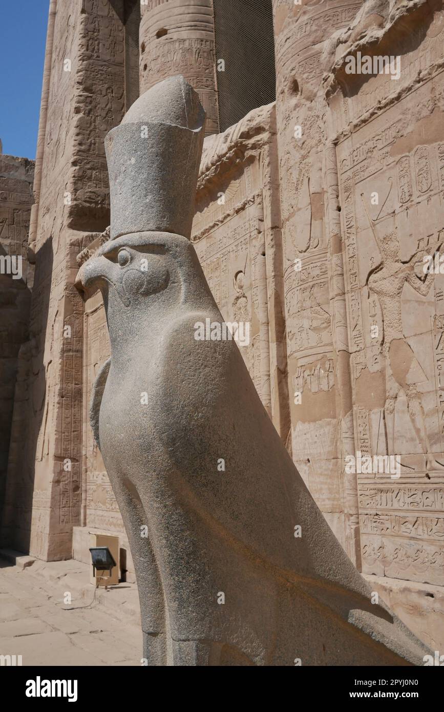 Statue of Horus stands guard outside the ancient temple of Edfu in ...