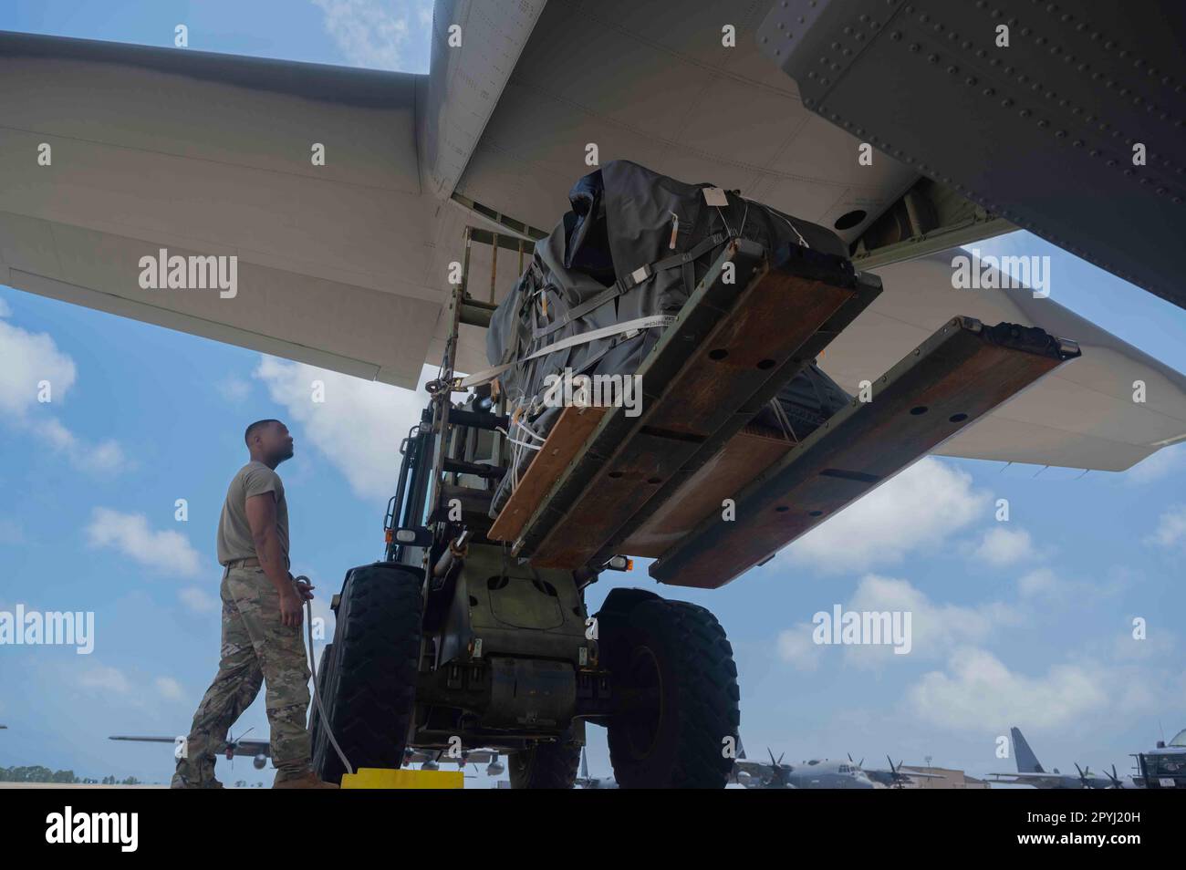 Loadmasters assigned to the 24th Special Operations Wing load a Rigging ...