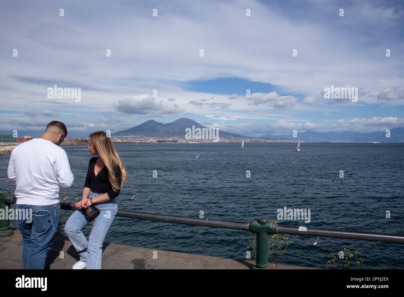 Naples, Italy. 03rd May, 2023. Boy and girl on the seafront in Naples ...