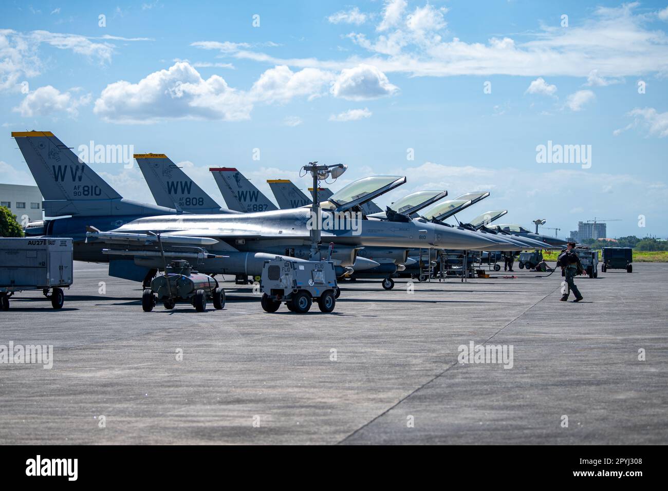 A pilot assigned to the 14th Fighter Squadron walks toward a lineup of ...