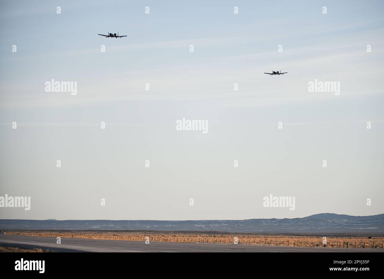 A pair of A-10 Thunderbolt IIs fly over Highway 287 during Exercise ...