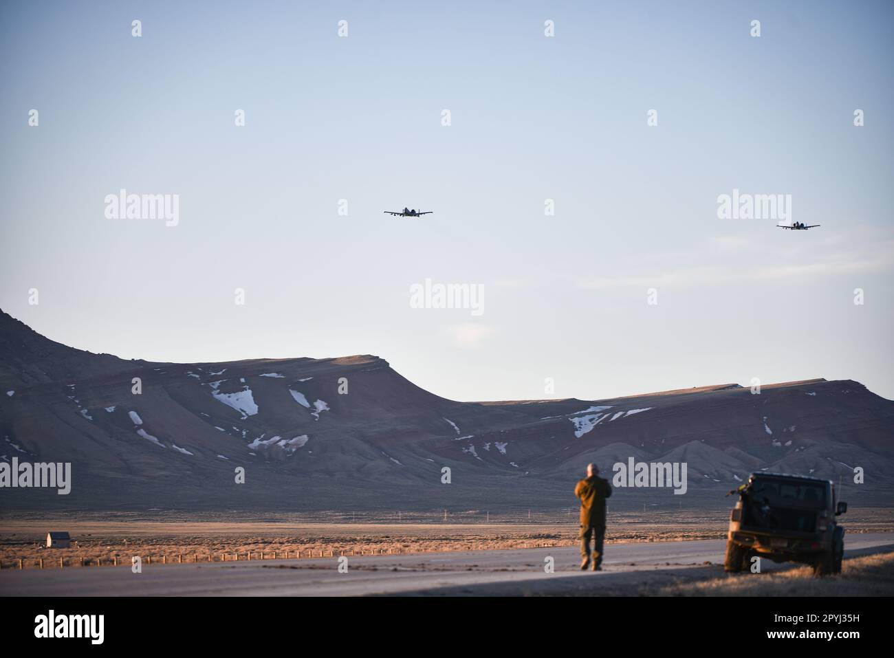 A pair of A-10 Thunderbolt IIs fly over Highway 287 during Exercise ...