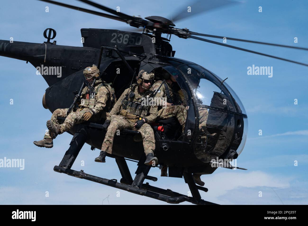 123rd Special Tactics Squadron operators load onto an MH-6 Little Bird ...