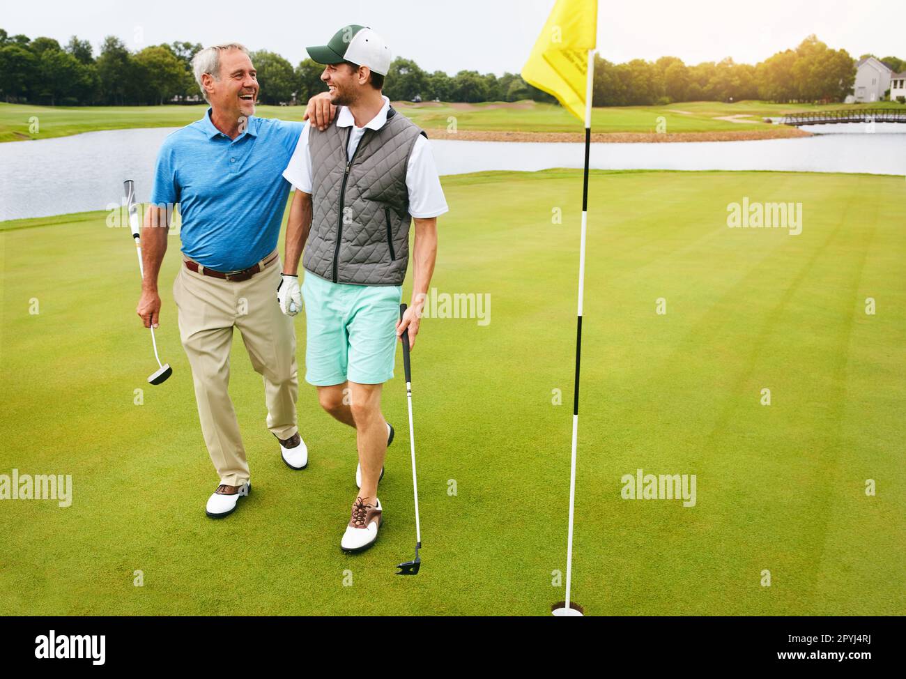Father son playing golf hi-res stock photography and images - Alamy