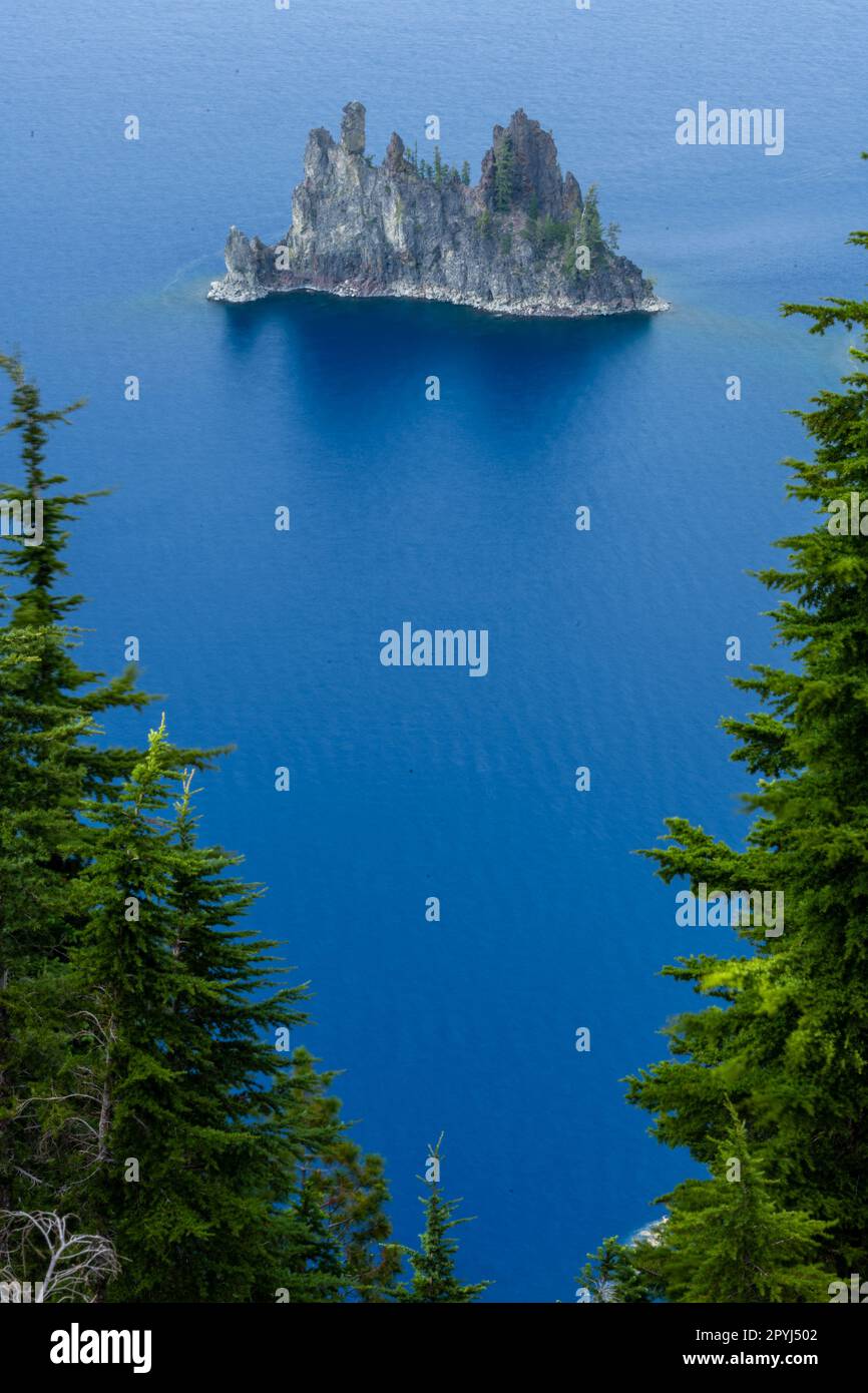 Phantom Ship Island Through the Bright Green Pines In Crater Lake ...