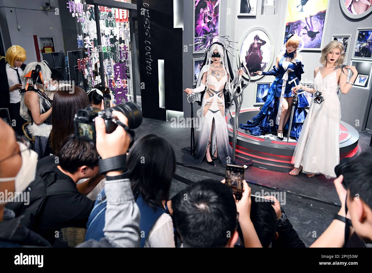 SHANGHAI, CHINA - MAY 3, 2023 - Visitors take photos of booth ...