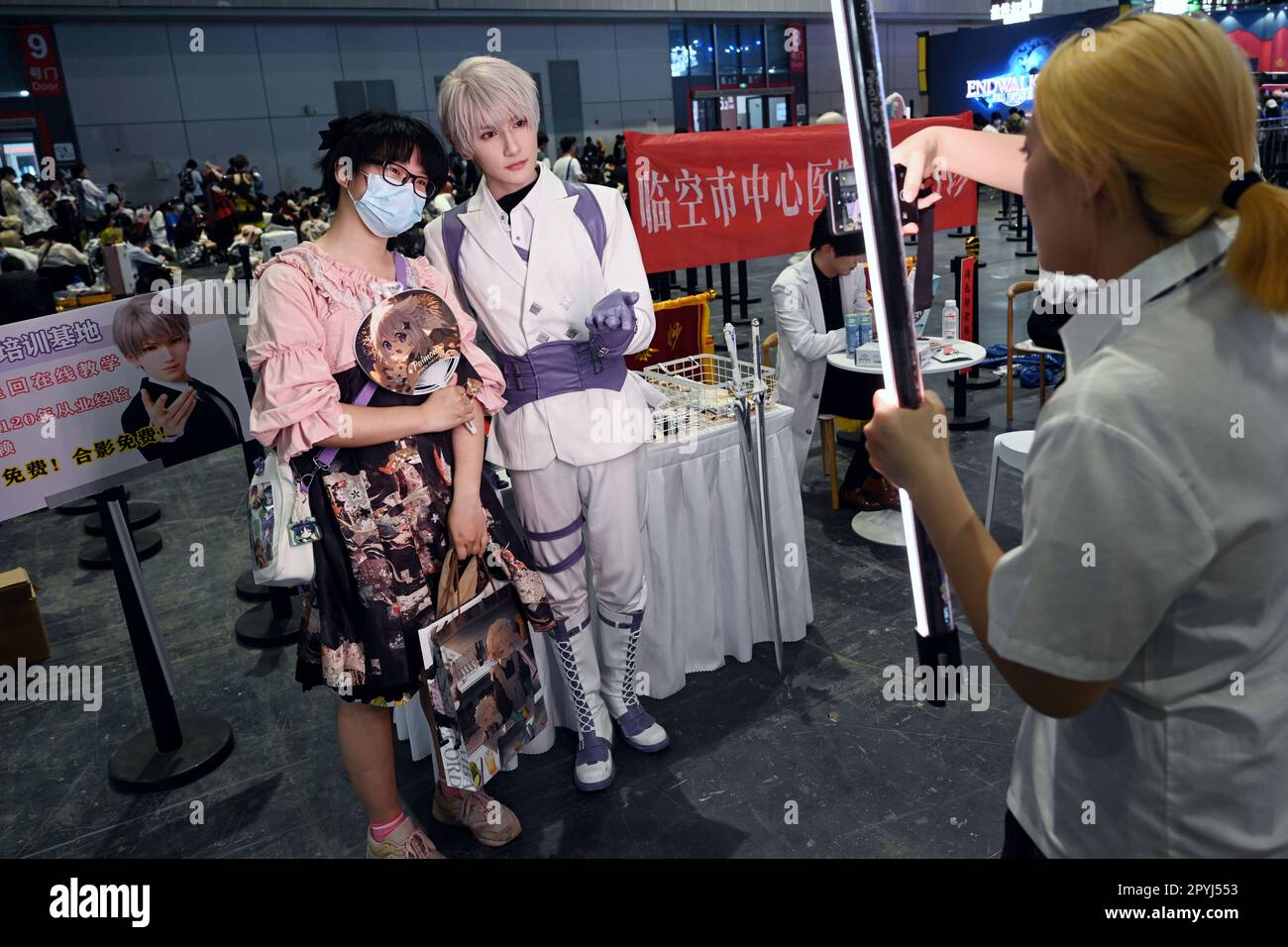 SHANGHAI, CHINA - MAY 3, 2023 - Love and deepspace Cosers pose with players at the 29th comicup ...