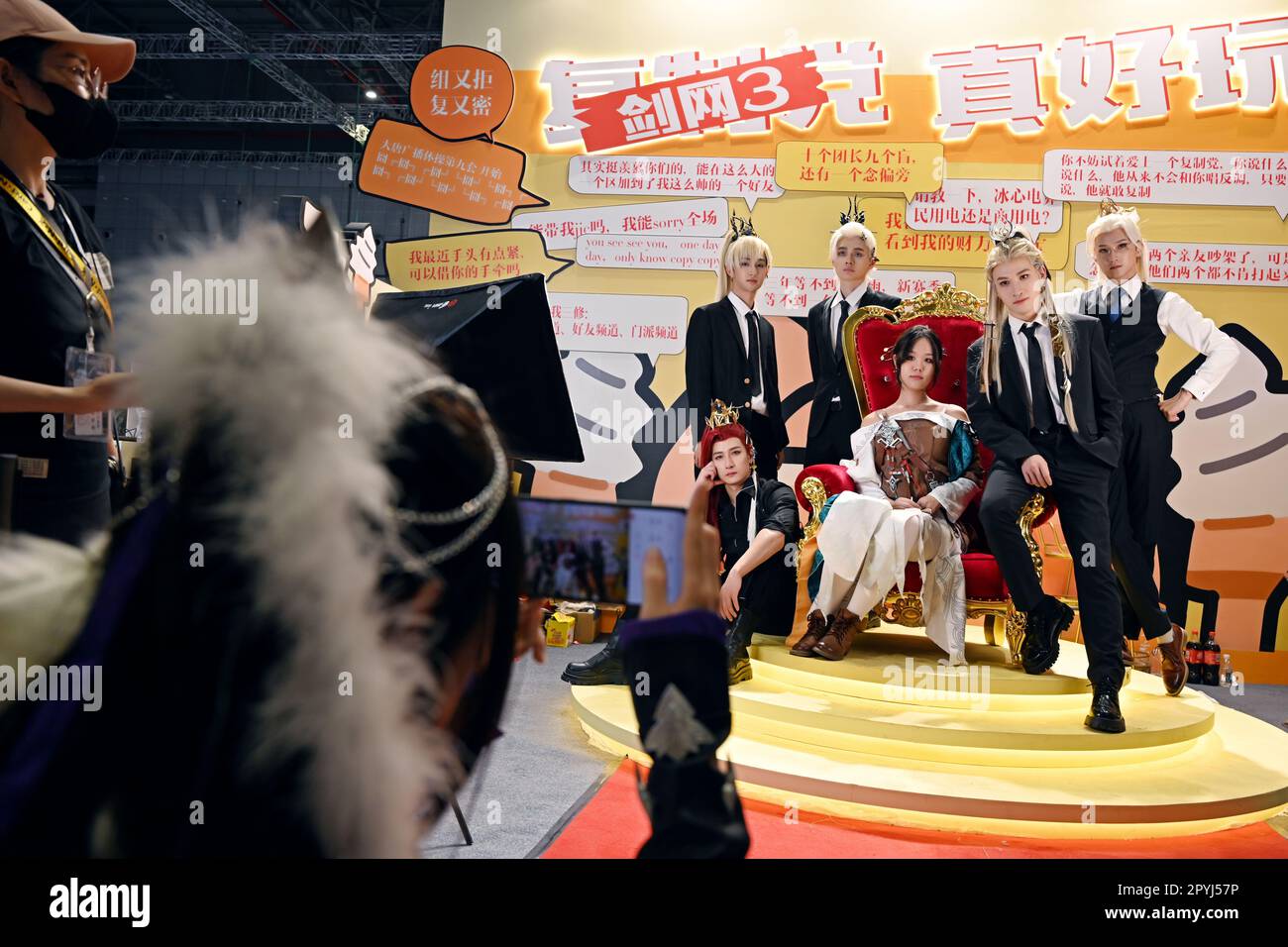 SHANGHAI, CHINA - MAY 3, 2023 - Players at a booth pose for a photo ...