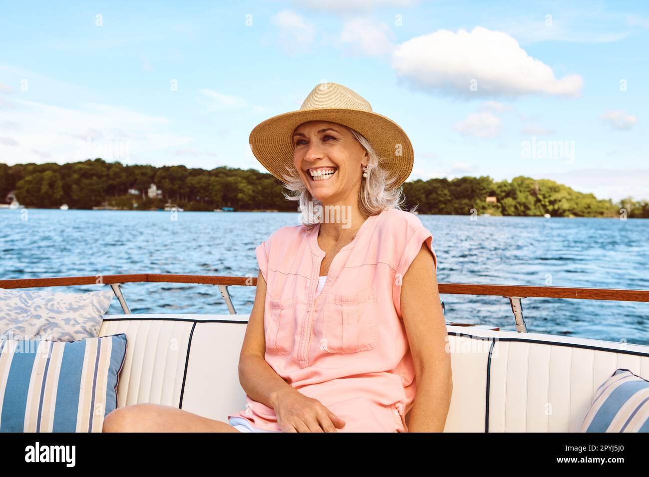 Time at sea is time well spent. a mature woman enjoying a relaxing boat ...