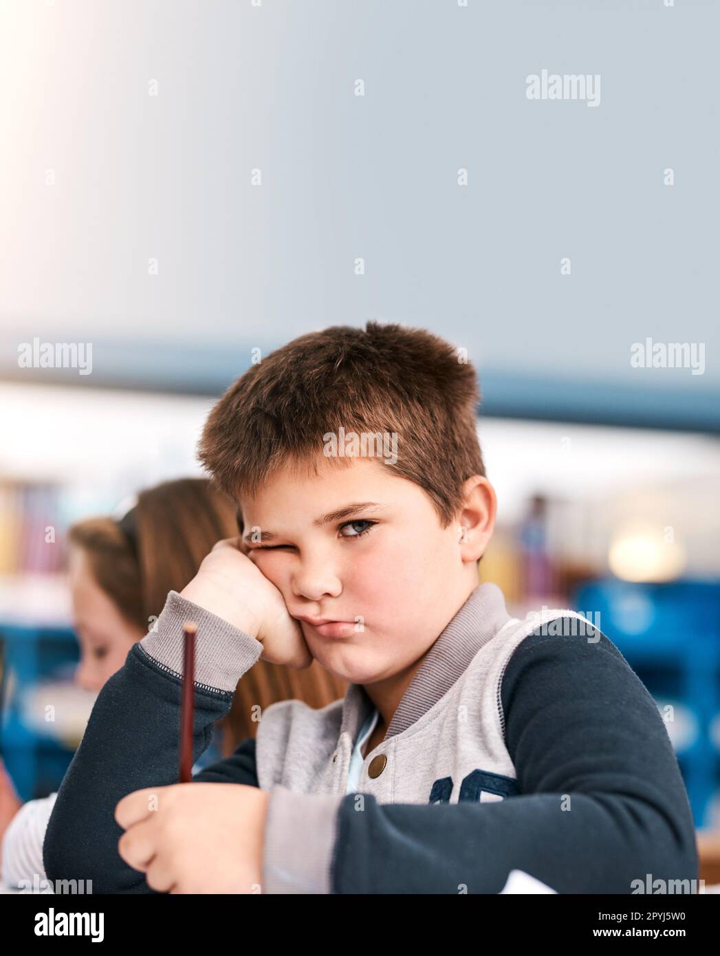 Im so bored with the work. Portrait of shot of a grumpy elementary ... Im so bored with the work. Portrait of shot of a grumpy elementary ...