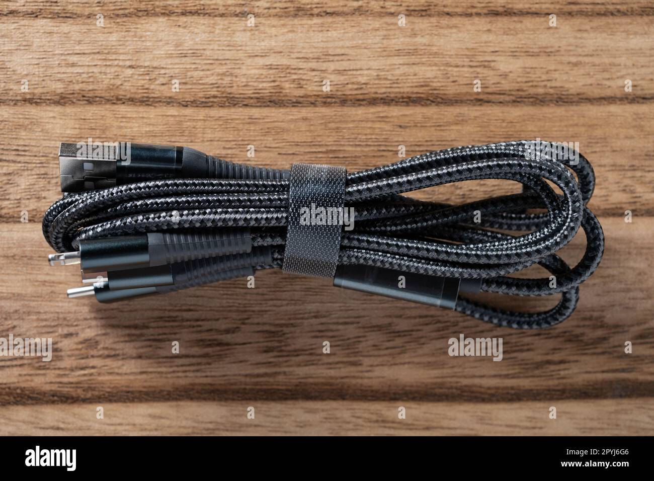 top view multi-plug cable on a wood background Stock Photo - Alamy
