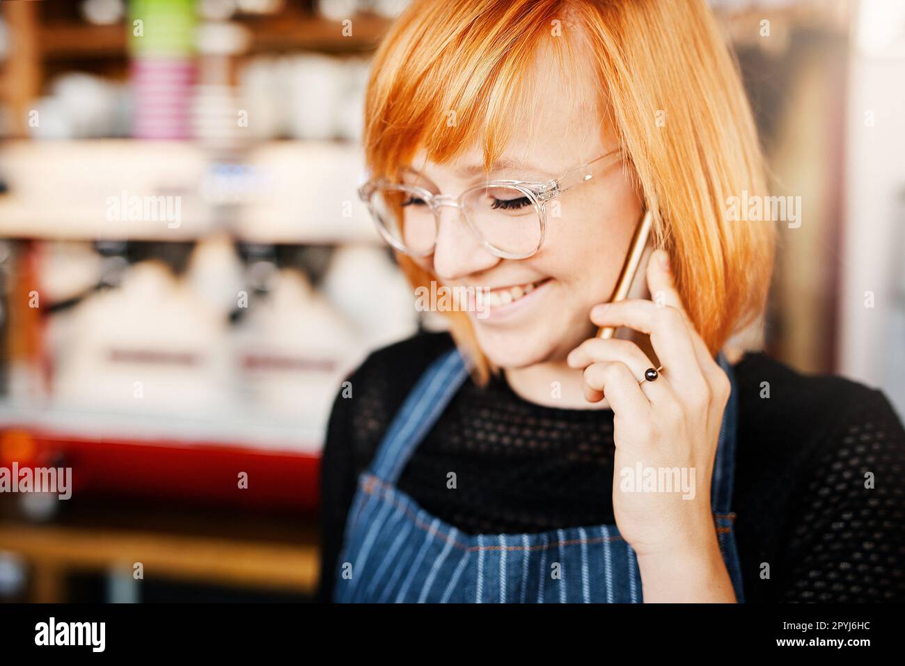 Clients always call to say hi. a shop assistant talking on her ...