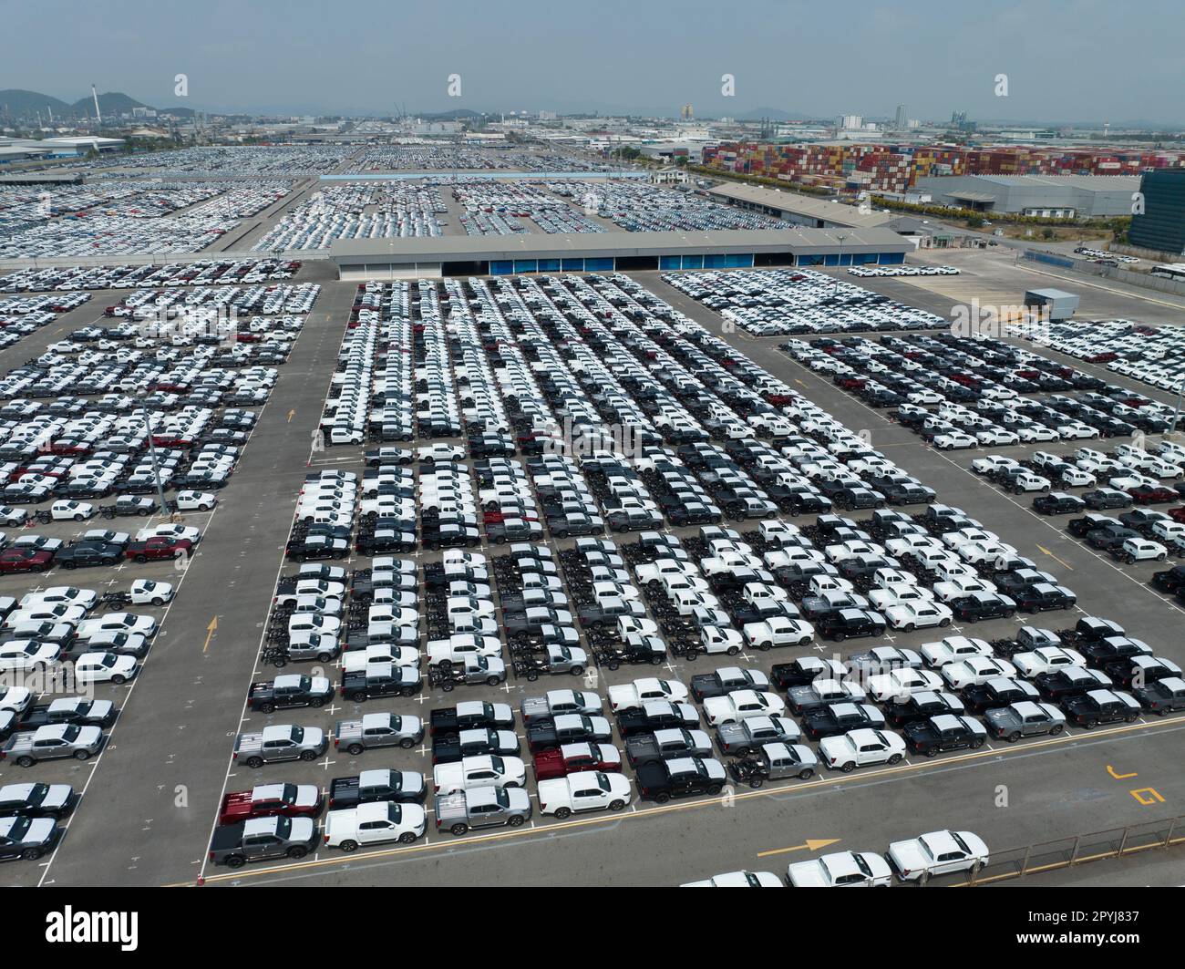 Aerial view of new cars stock at factory parking lot. Above view cars ...