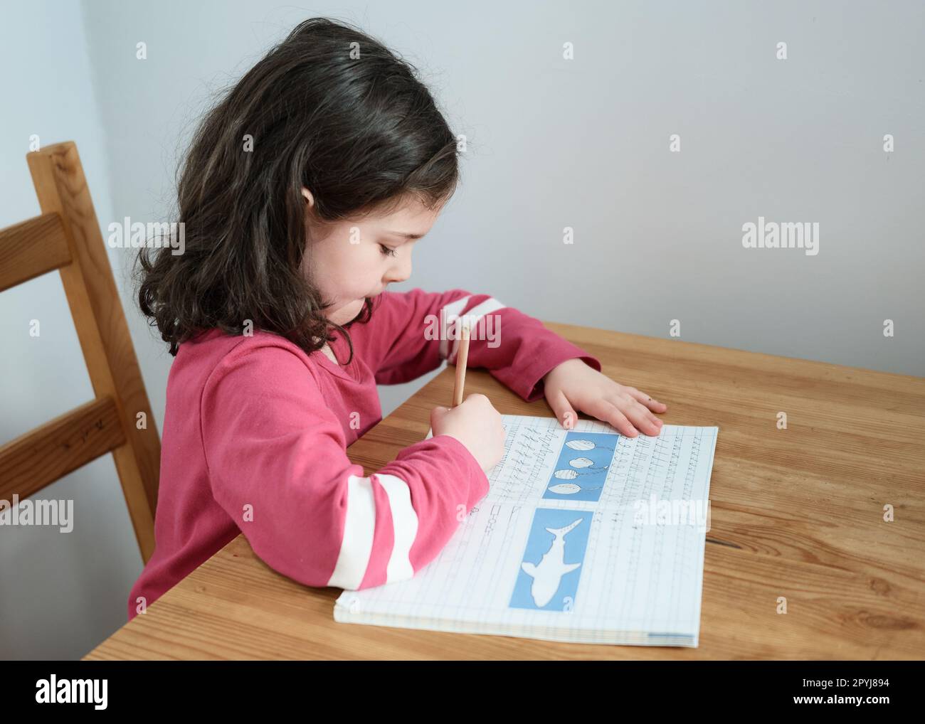Child writing lines hi-res stock photography and images - Alamy