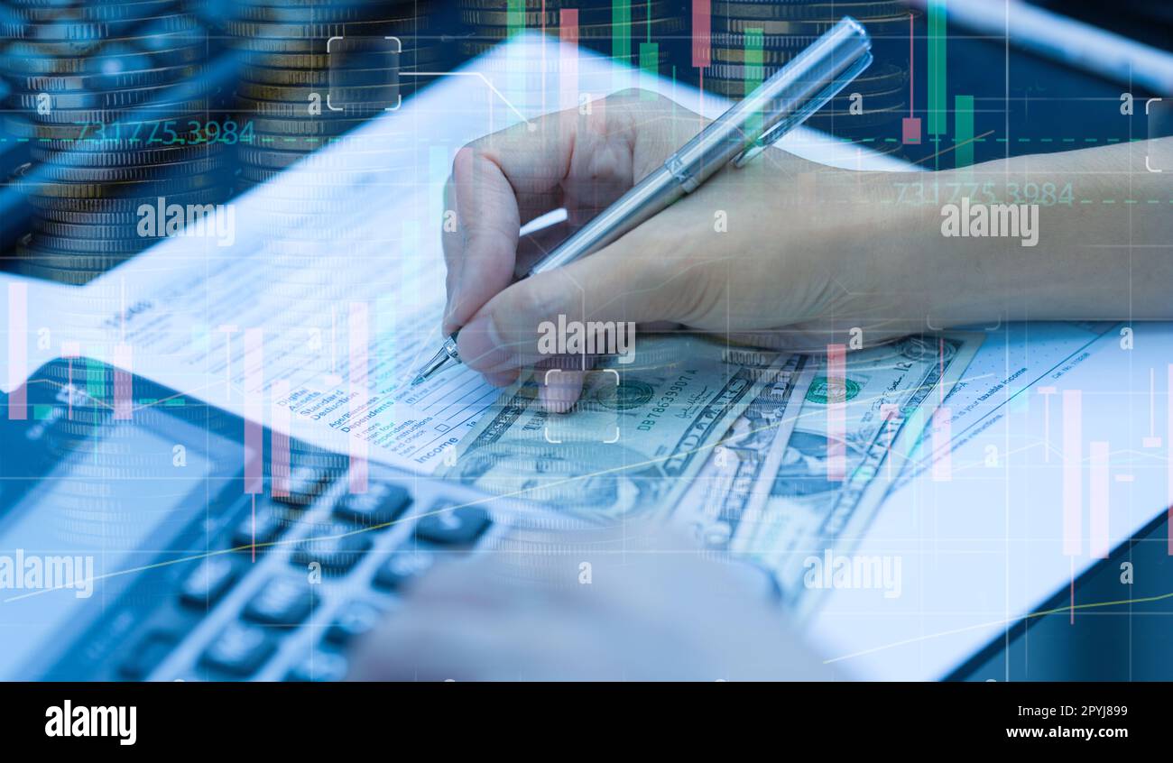 Tax season concept. Woman hand filing US income tax return form for tax ...