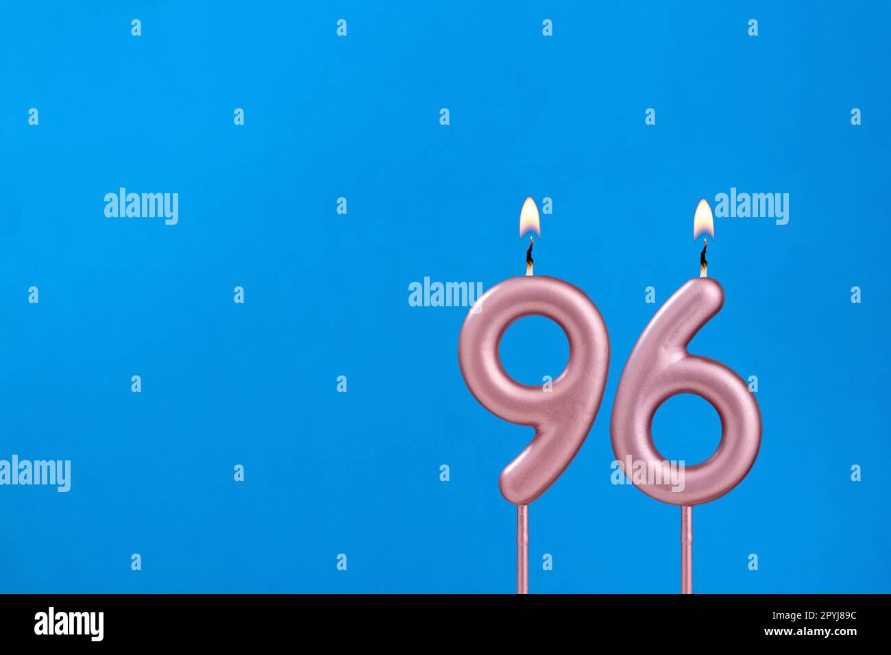Candle number 96 - Birthday in blues foamy background Stock Photo - Alamy