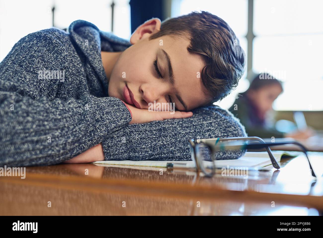 Ill just rest my head for a minute...an elementary school boy sleeping ...