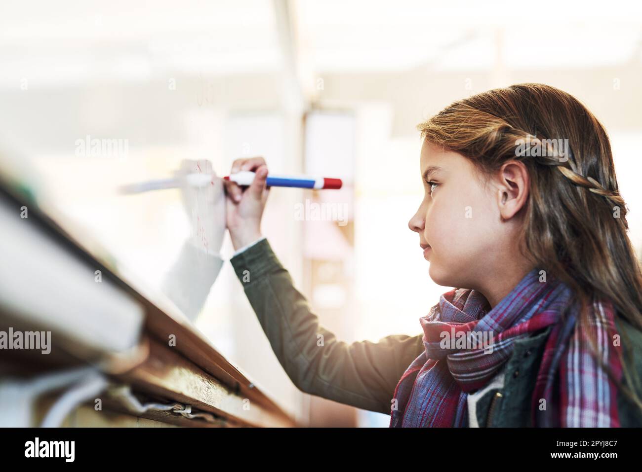 Shes teaching the whole class a lesson today. an elementary school girl ...