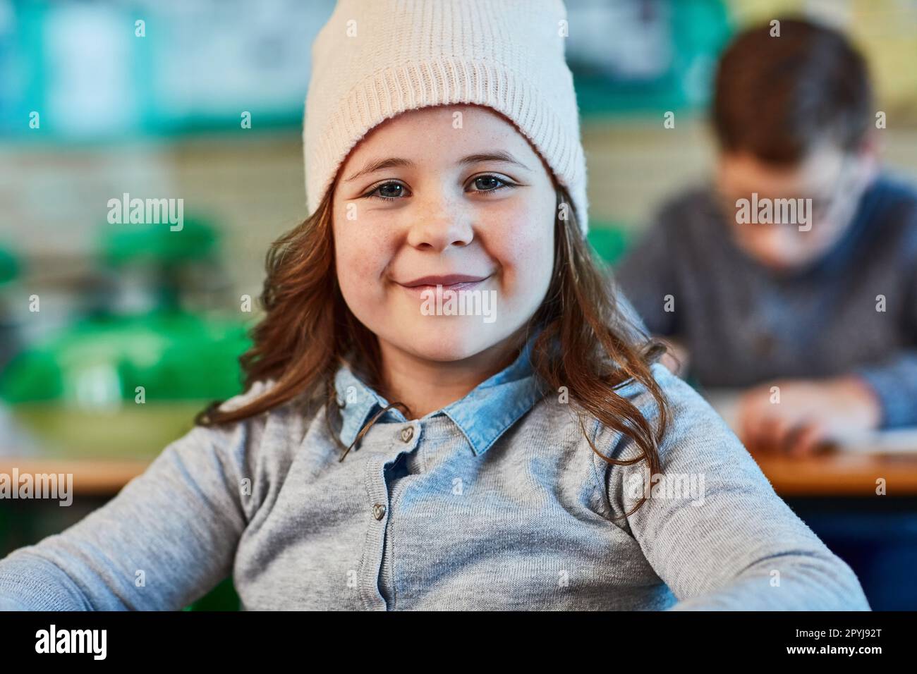 Happy to be in class. an elementary school girl in the classroom Stock ...