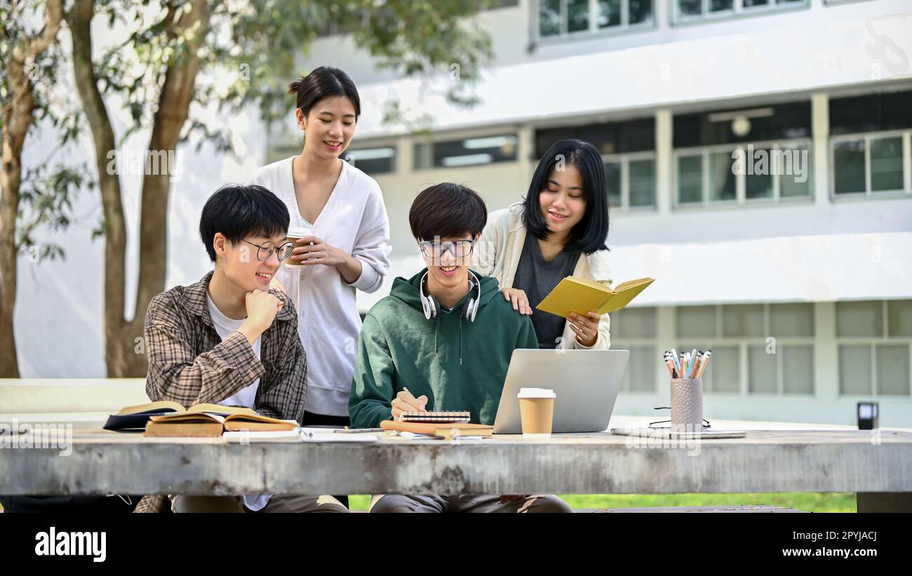 Group of happy and cheerful young Asian college students are ...
