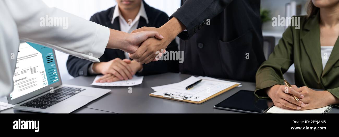 Interviewer handshaking the applicant hi-res stock photography and ...
