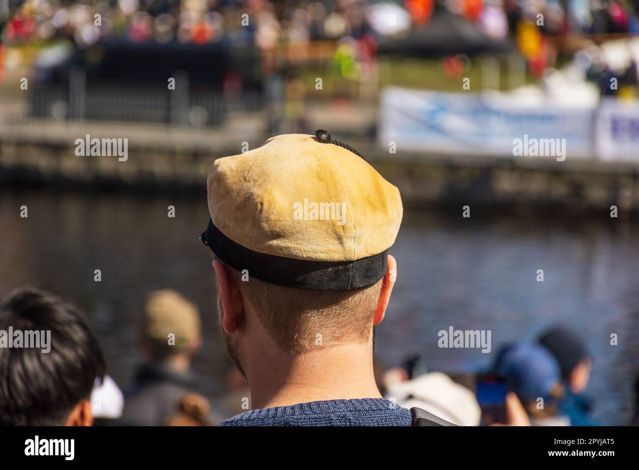 Man wearing an old graduation cap on at May day Student dipping ...