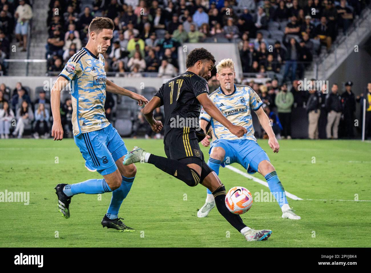 LAFC midfielder Timothy Tillman (11) is defended by Philadelphia Union ...