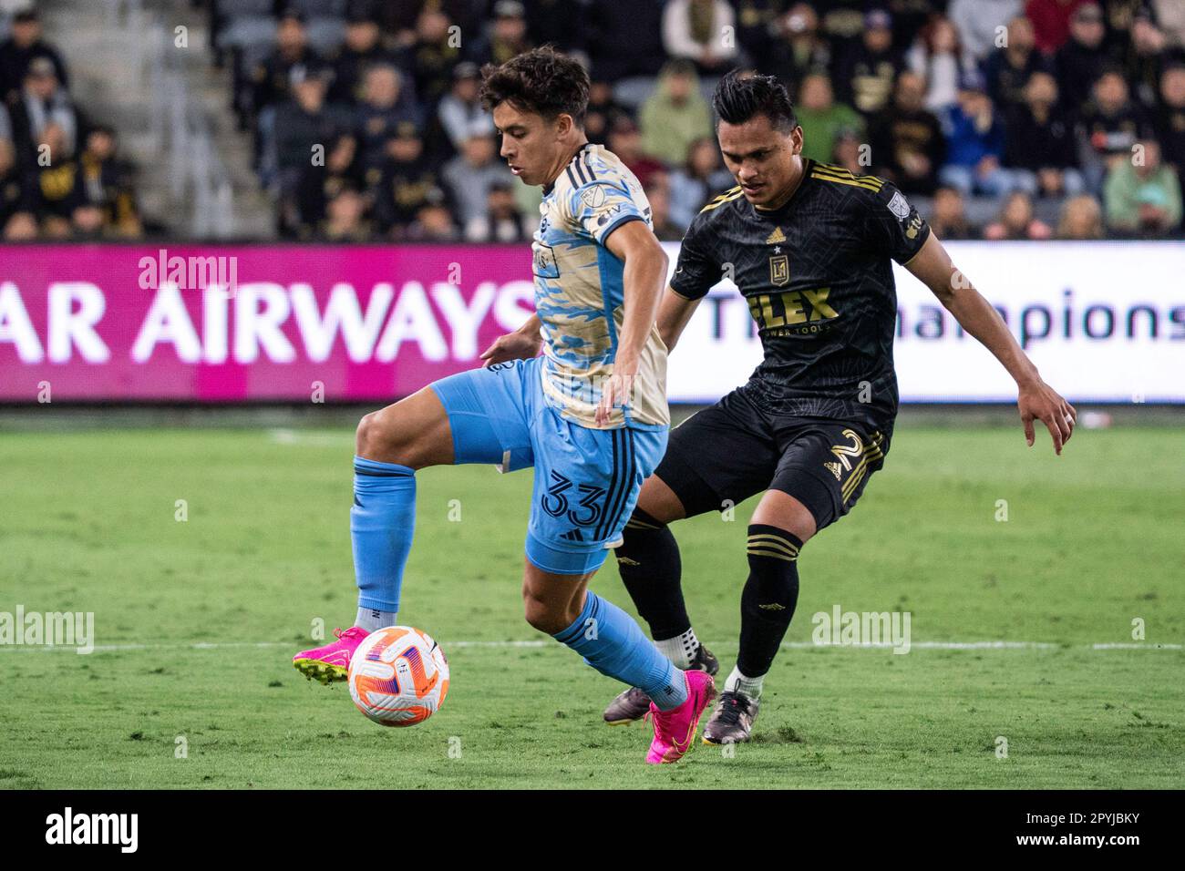 Philadelphia Union midfielder Quinn Sullivan (33) is defended by LAFC ...