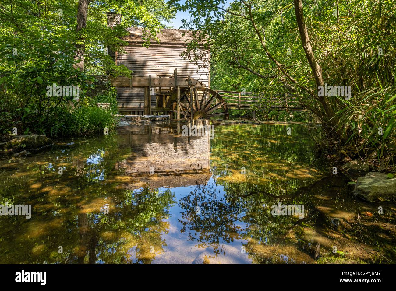 Scenic old Grist Mill with active overshot waterwheel at Stone Mountain ...