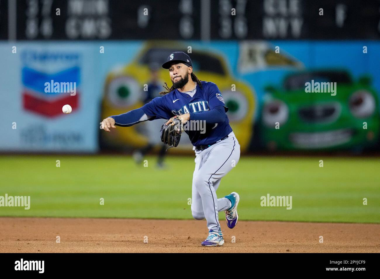 Seattle Mariners shortstop J.P. Crawford throws to first for an out on ...