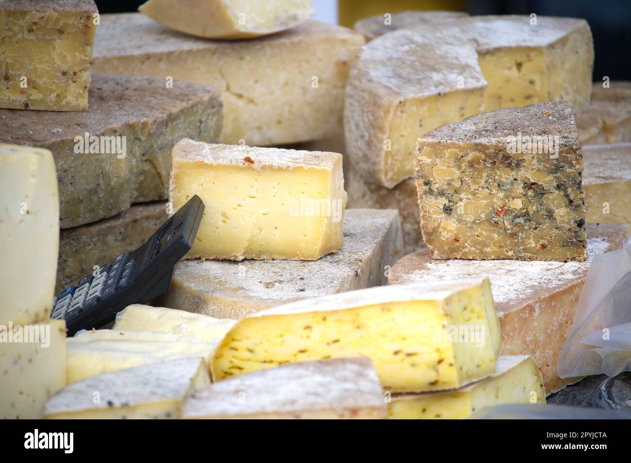 The different types of hard cheese for sale on a farmers market ...