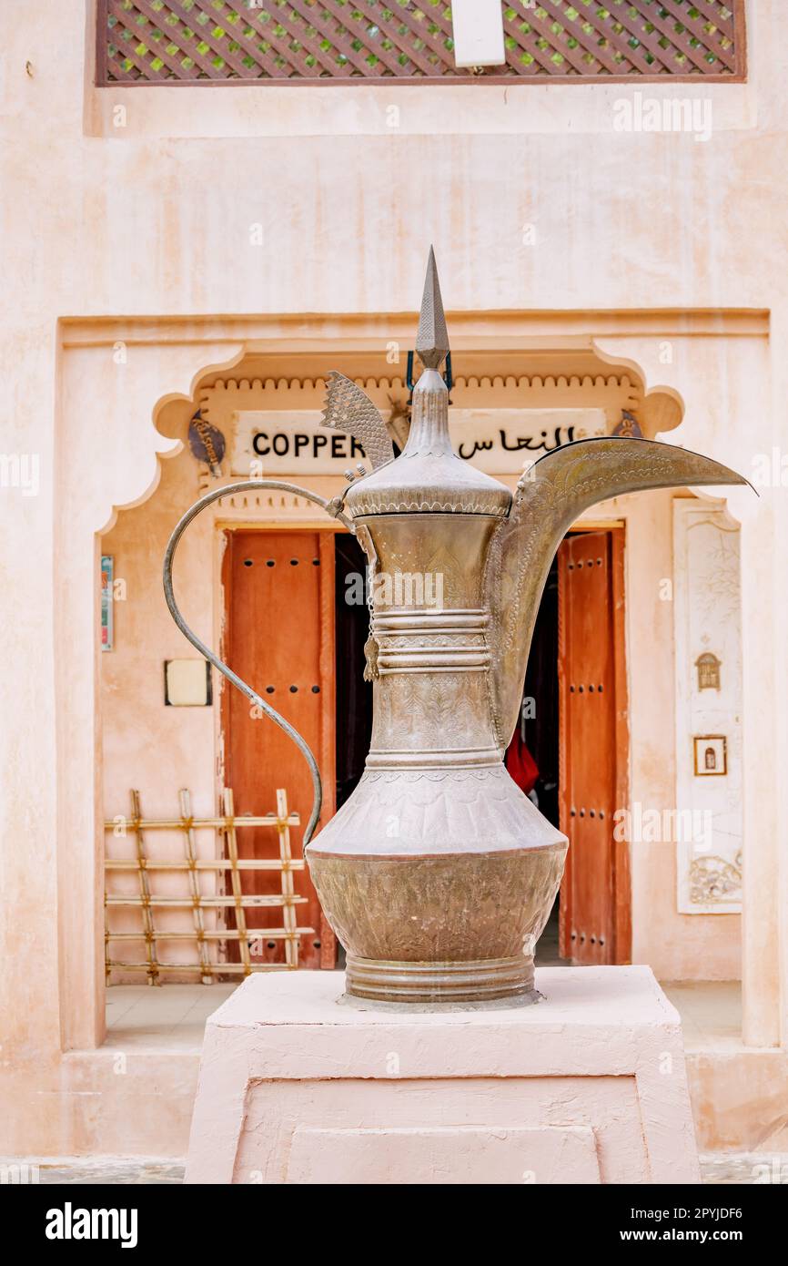 15 January 2023, Abu Dhabi, UAE: Copper arabic traditional coffee pot ...