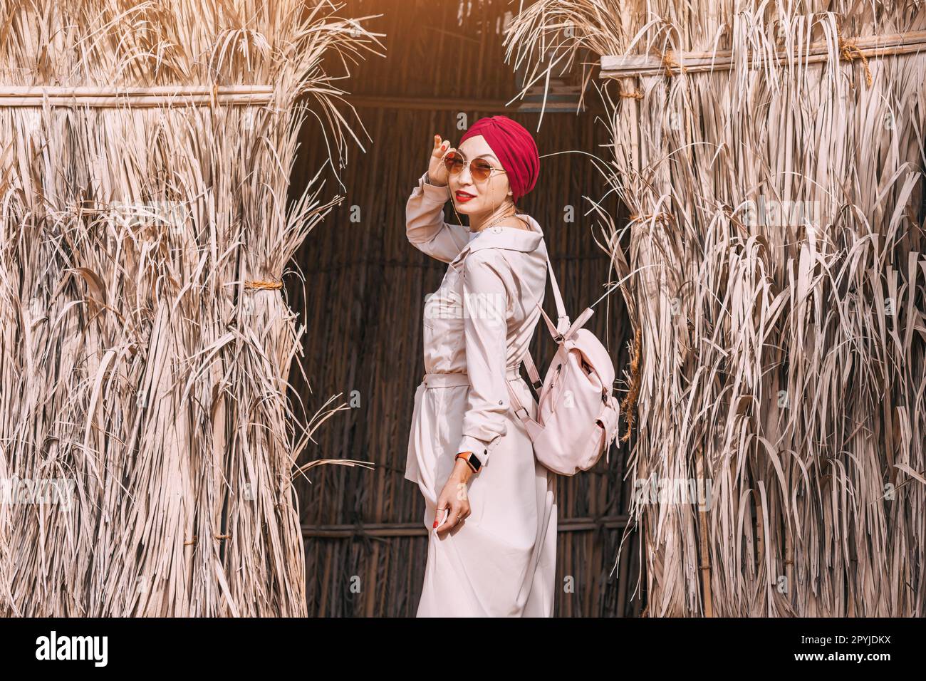 Girl in indian turban exploring arabian heritage village in Abu Dhabi ...