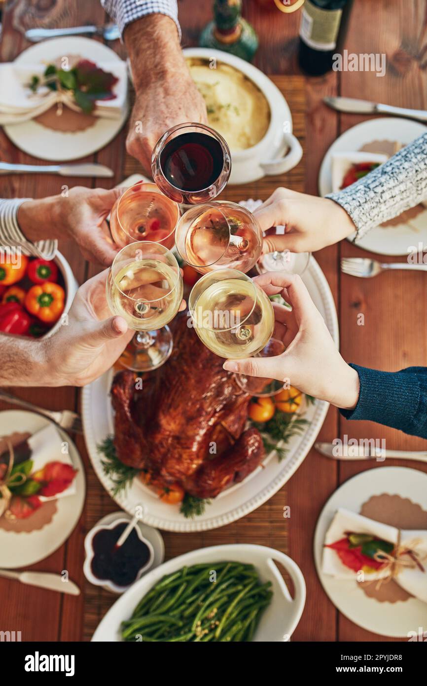 Heres to great food and great people. Hight angle shot of a group of ...