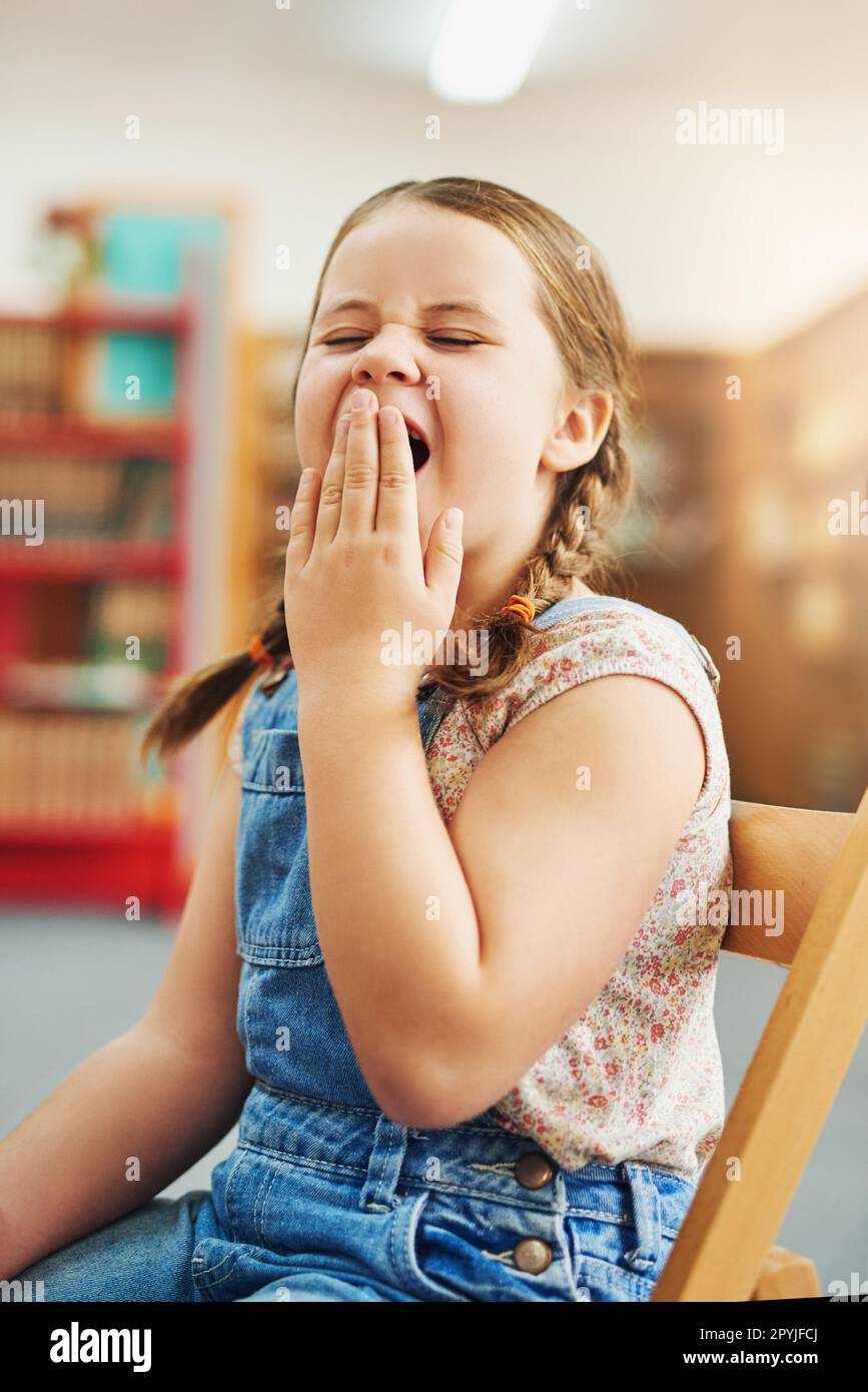 Girl yawning in classroom hi-res stock photography and images - Alamy