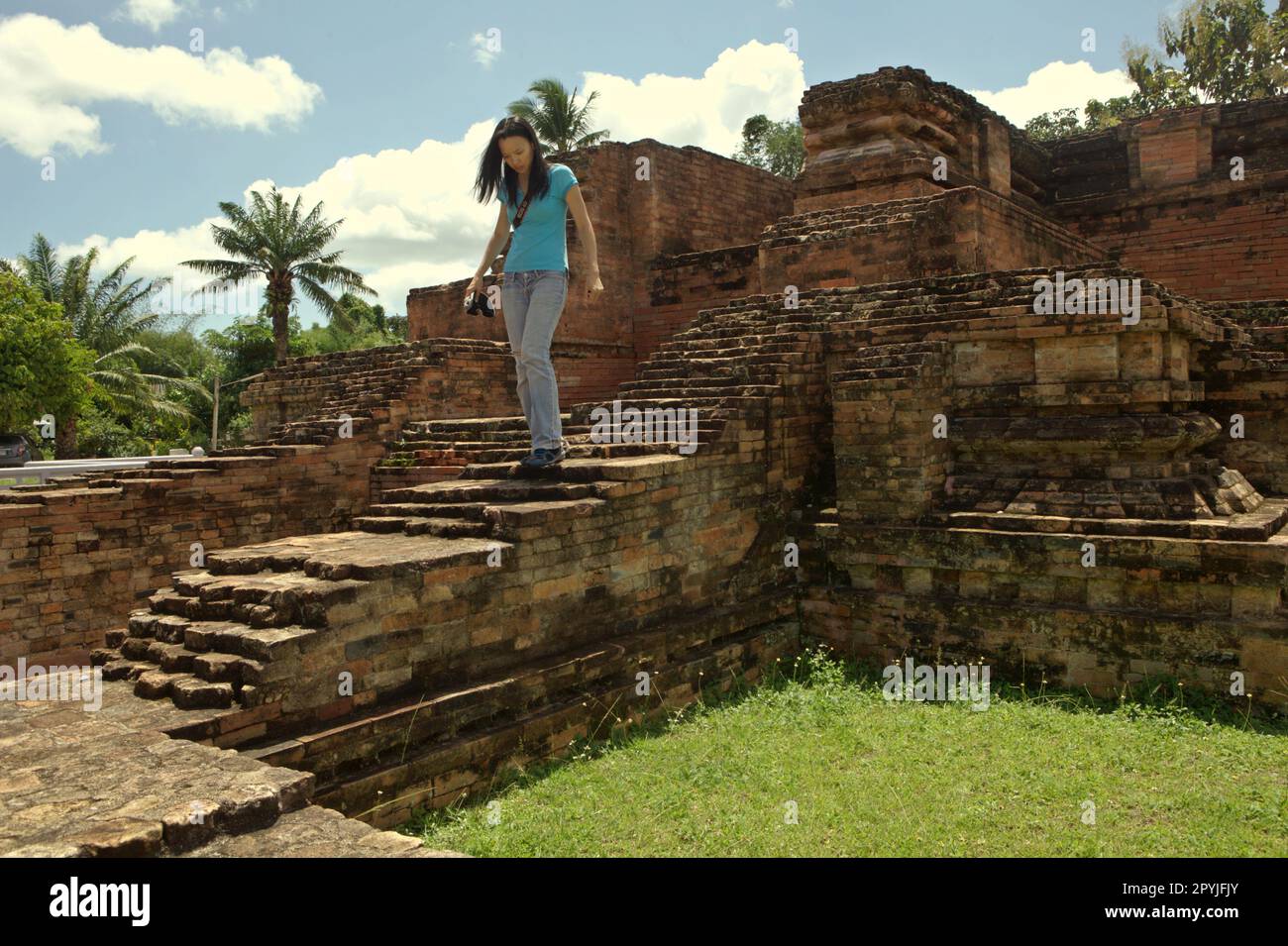 A tourist guide is photographed at Wat Long temple in Chaiya, Surat ...