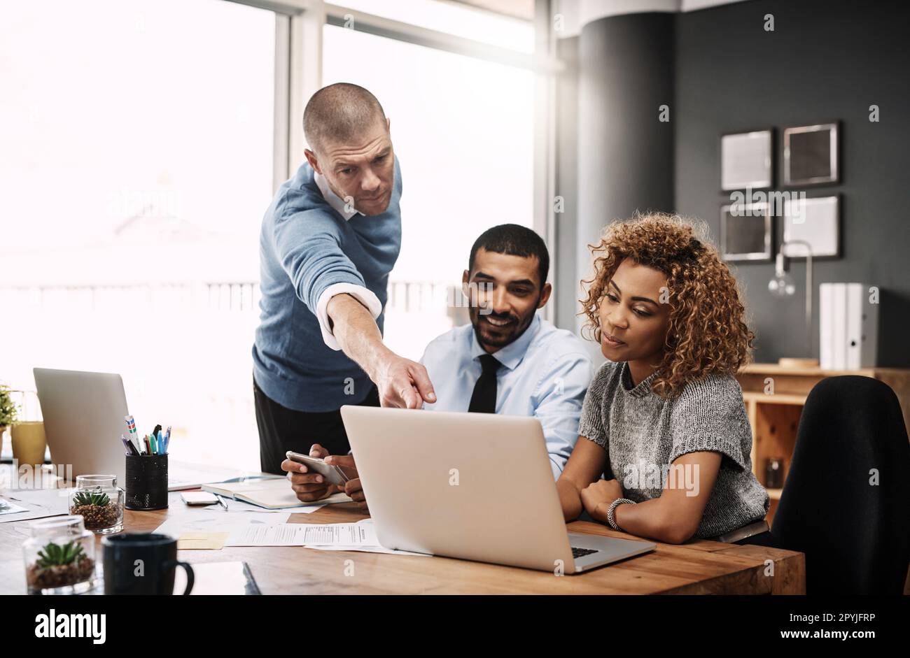 Lending a helping hand. a businessman giving a presentation to his ...