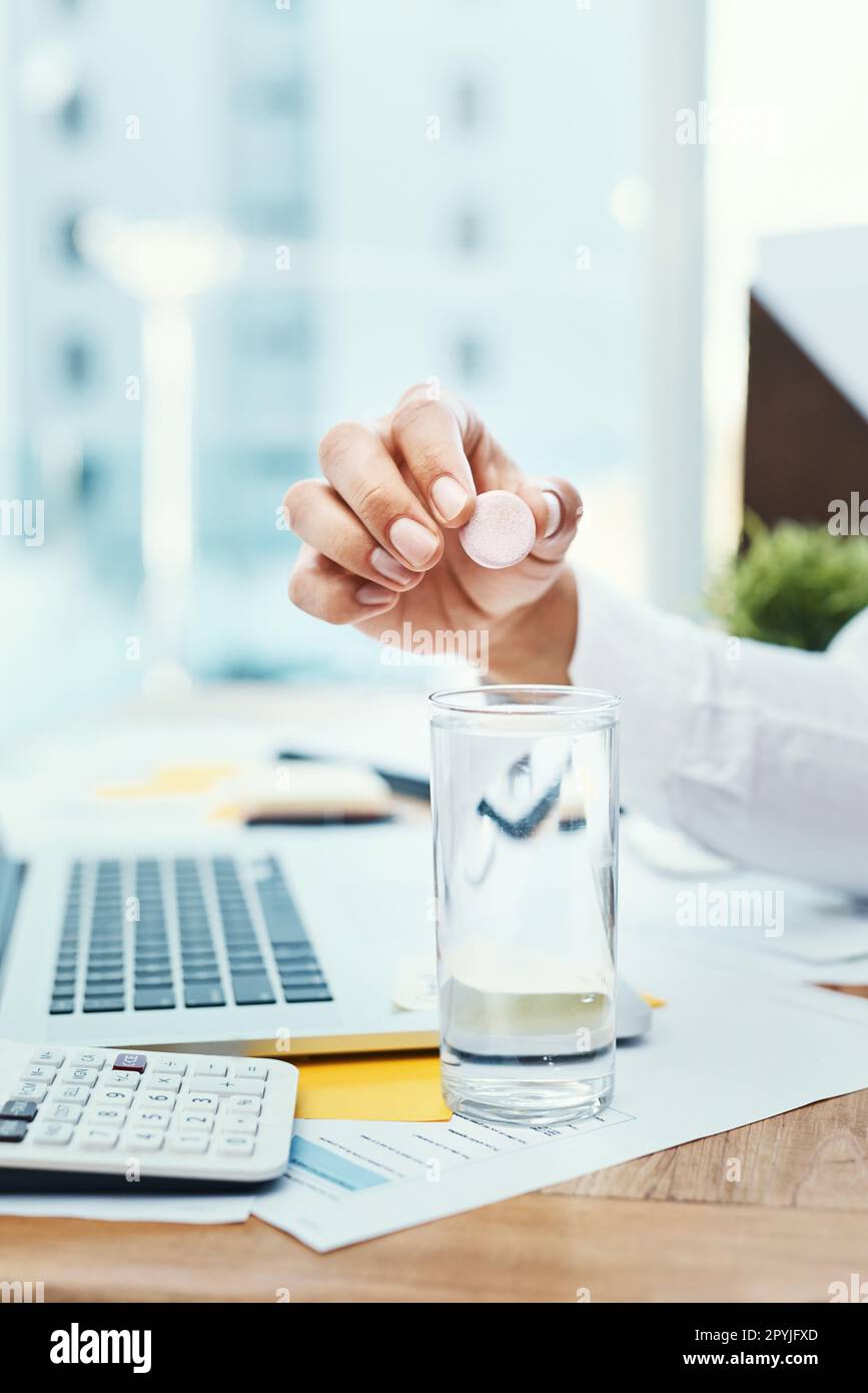 Preparing a vitamin supplement for a boost of energy. an unrecognizable ...