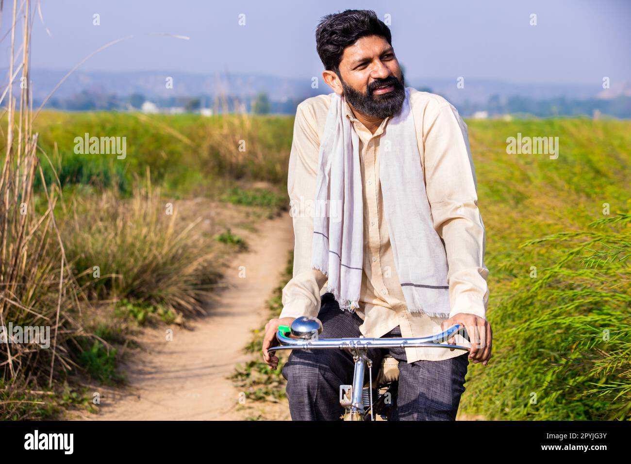 Indian man riding cycle in hi-res stock photography and images - Alamy